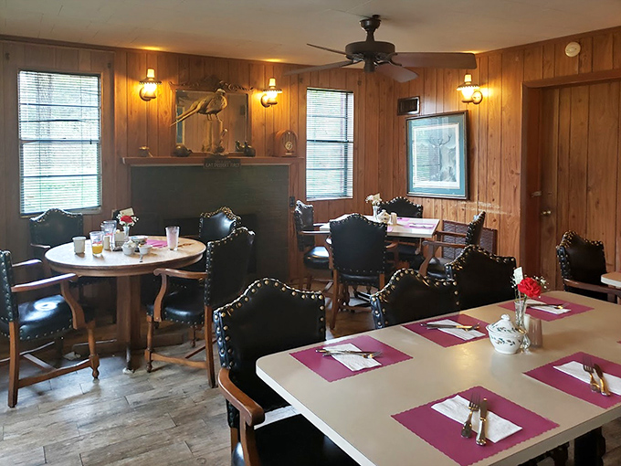 Leather chairs and pink placemats create a dining room that's both rustic and refined – like your favorite uncle who unexpectedly appreciates fine wine.