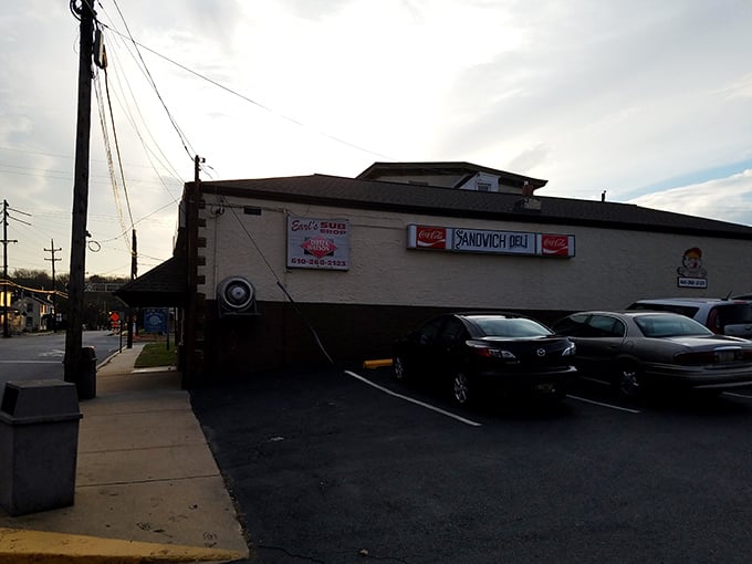 The parking lot view reveals Earl's other identity—"Sandwich Deli"—because one name isn't enough for a place this good.
