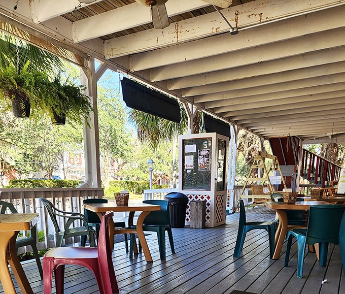 The porch seating area, where colorful chairs invite conversation and the gentle Florida breeze serves as background music.