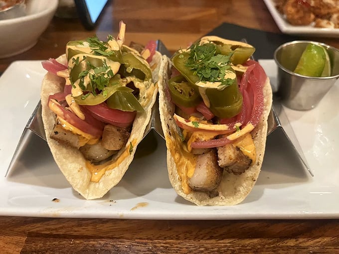 These tacos aren't just filled—they're architectural wonders balancing meat, acid, and heat with artistic precision. 