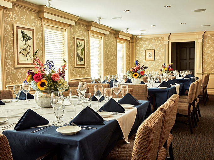 Private dining that whispers "special occasion" without shouting it—those floral arrangements aren't just decorations, they're conversation starters.