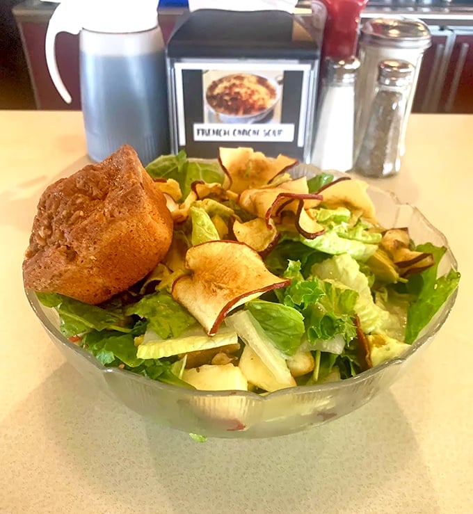 Even the salad comes with a side of butter cake, because The Dining Car understands priorities and balance.