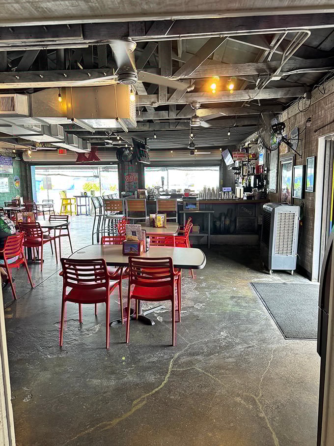 No white tablecloths needed when the seafood is this good—just red chairs, concrete floors, and the promise of Gulf treasures on every plate.