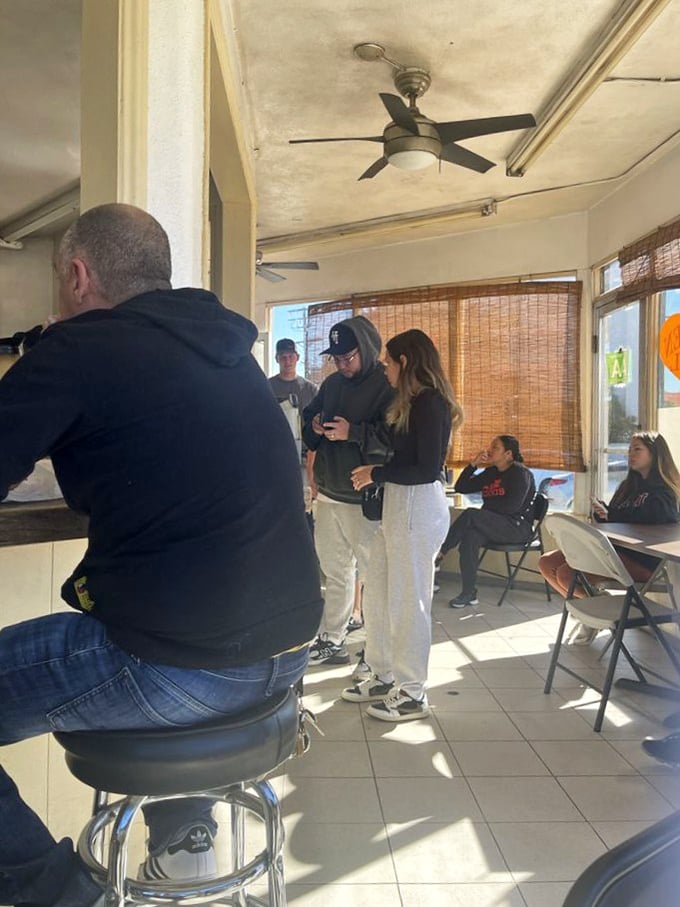 The indoor seating area—where strangers become temporary friends united by the universal language of "this food is amazing."