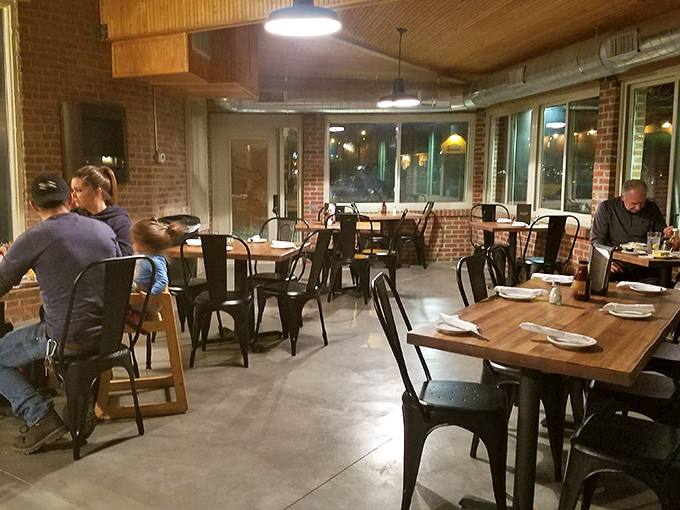 Evening dining at its most comfortable. The warm glow from those pendant lights makes everyone look like they're in a food commercial.