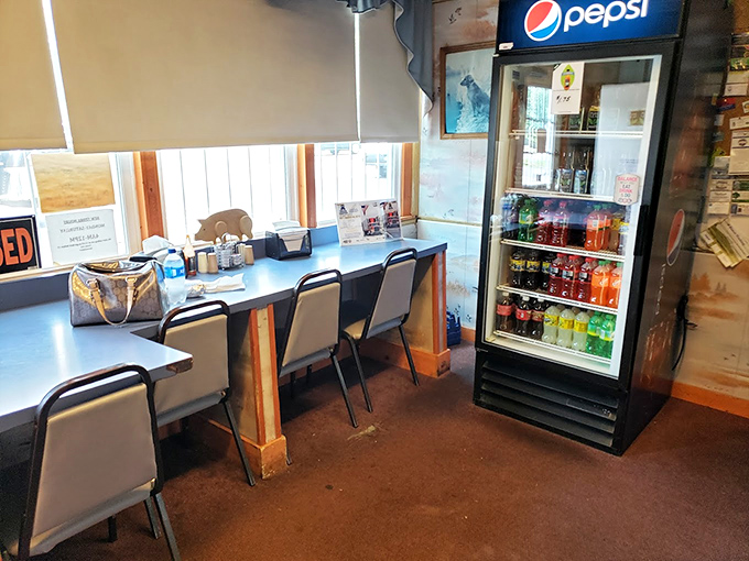 Simple tables, practical chairs, and a cold drink cooler—because when the food is this good, you don't need fancy furniture.