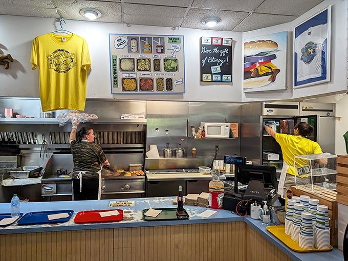 The heart of the operation – where burger magic happens in full view. No secrets here, just time-honored techniques and practiced hands.