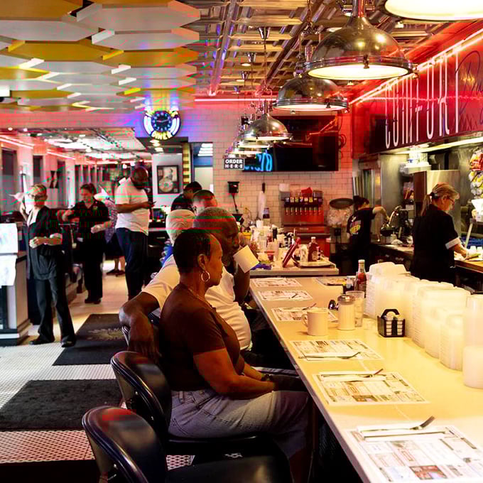 The serving counter where dreams become reality and coffee flows like a caffeinated river of happiness.