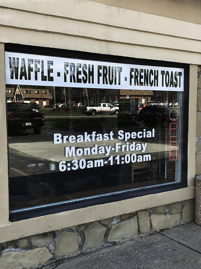The breakfast special hours proudly displayed like a proclamation: "Early risers shall be rewarded with waffle and French toast treasures!"