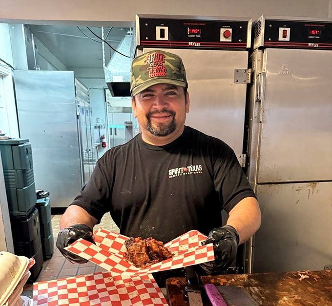 The look of a pitmaster who knows his brisket is about to change someone's life. That thumbs up isn't confidence—it's a guarantee.