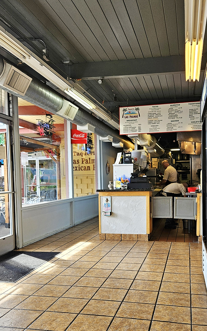 The heart of Las Palmas—where orders are taken and culinary dreams fulfilled. That menu board overhead isn't just a list; it's a roadmap to satisfaction.