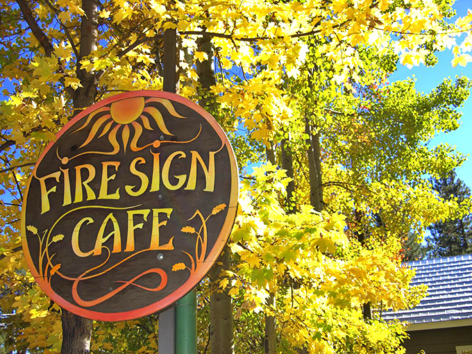 Fall's golden backdrop perfectly frames the café's iconic sign—like Mother Nature herself is highlighting where you should eat this morning.