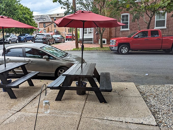 Those picnic tables outside aren't just seating—they're front-row tickets to the neighborhood's daily show, with a side of excellent people-watching.