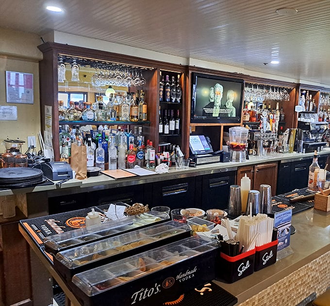 A bar stocked for serious maritime drinking. Those bottles aren't just alcohol—they're liquid courage for when the check arrives.