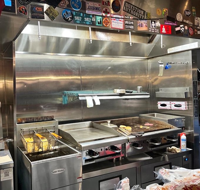 The gleaming grill—hallowed ground where simple ingredients transform into the burgers that keep people coming back week after week.