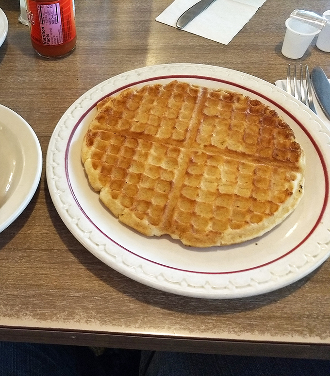 A waffle that doesn't need to call itself "Belgian" or "artisanal" to command respect—just perfectly crisp outside, tender inside, and ready for syrup.