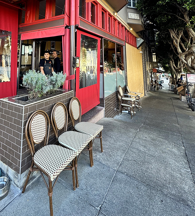 The sidewalk view where staff greet regulars like long-lost relatives. Those café chairs have "sit and stay awhile" written all over them.