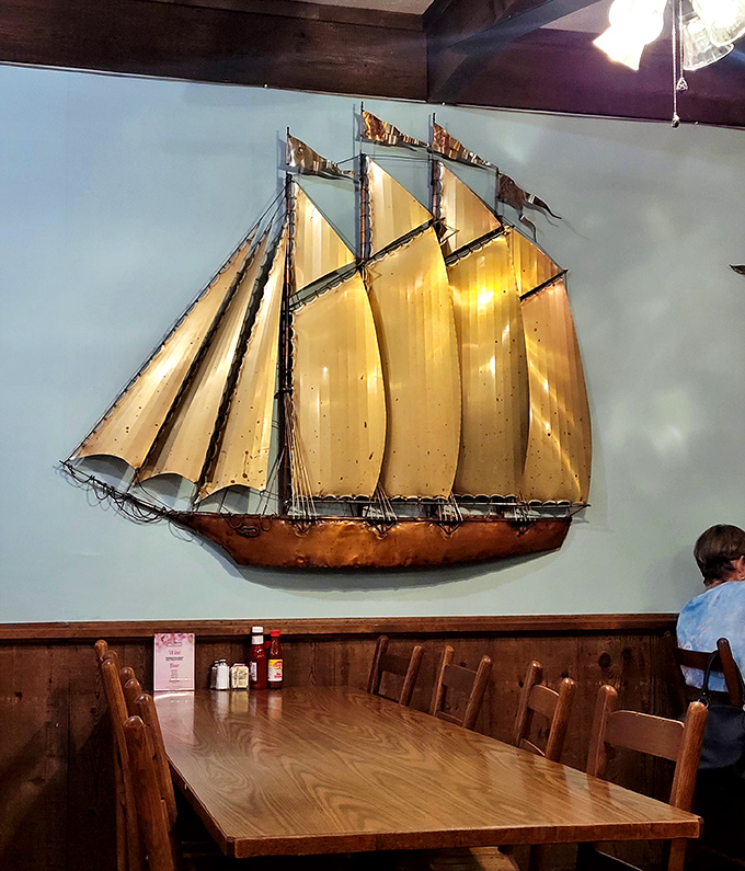That sailboat wall art isn't just decoration—it's a reminder you're in seafood country now, where the catch of the day isn't just marketing speak.