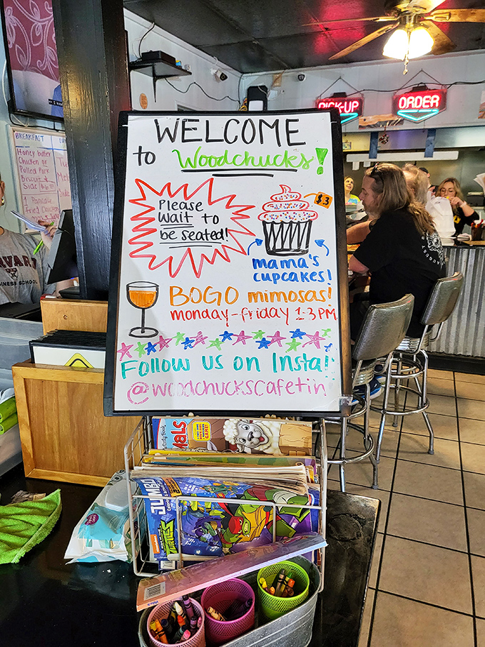 The welcome board announces cupcakes, mimosas, and Instagram handles—a colorful roadmap to the delights that await inside.