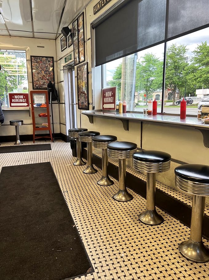 Window seats offer prime people-watching with your meal—observe the mix of regulars and first-timers all experiencing the same slider euphoria.