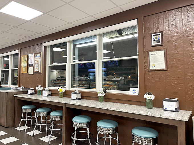 Counter seating – where solo donut enthusiasts can contemplate life's big questions while watching the masters work their magic behind glass.