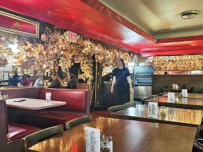 Every inch of wall space tells a story at Loui's. The memorabilia wasn't curated by a designer—it accumulated naturally, like pizza wisdom.