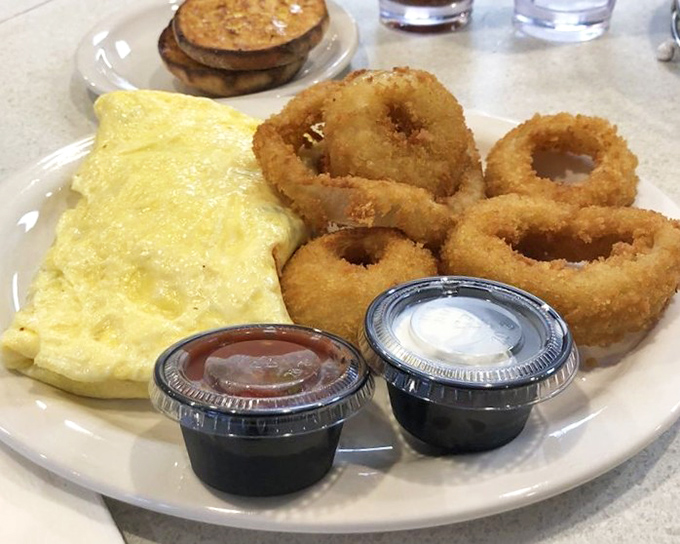 Omelet artistry that makes you wonder if the chef has a side hustle in architecture – perfectly folded and generously stuffed. 