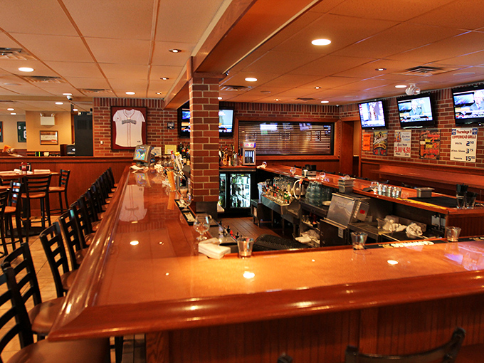 A gleaming bar top that's witnessed countless celebrations, commiserations, and conversations – the heart of any good sports grill.