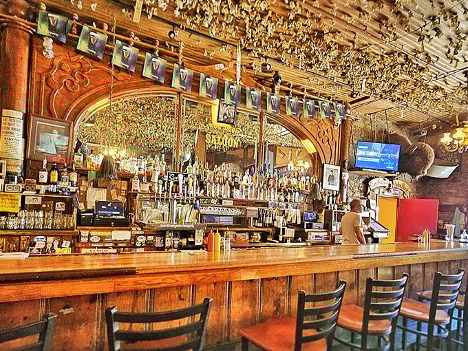 Dollar bills cling to every inch of ceiling above the magnificent wooden bar—each one representing a visitor's determination to leave their mark.