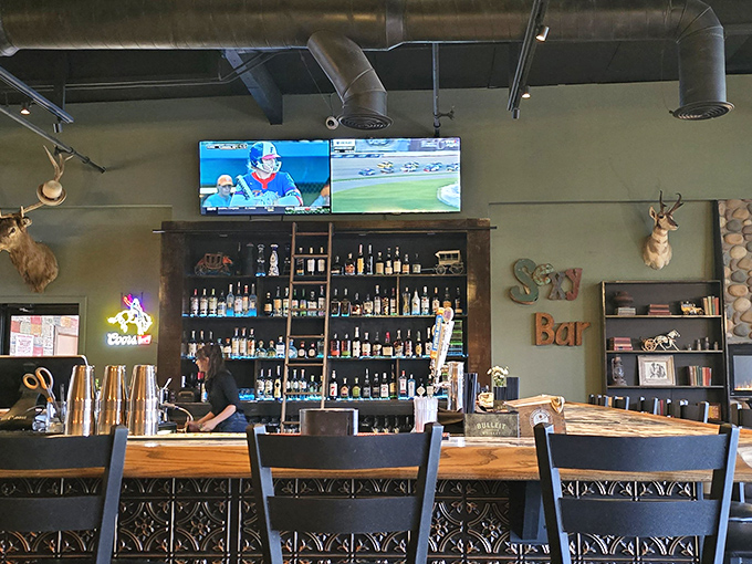 The bar isn't just stocked—it's curated, offering liquid companions for whatever wood-fired creation you've committed to for the evening.