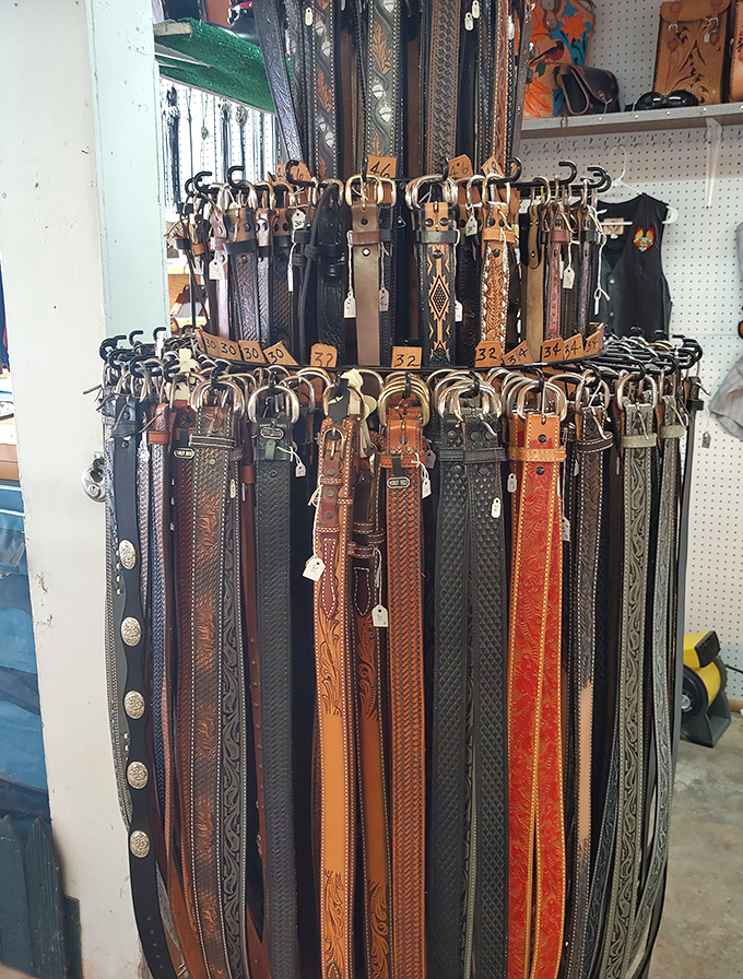 Leather belts hanging like patient sentinels—each one waiting for the perfect waist to circle and the perfect jeans to complete.