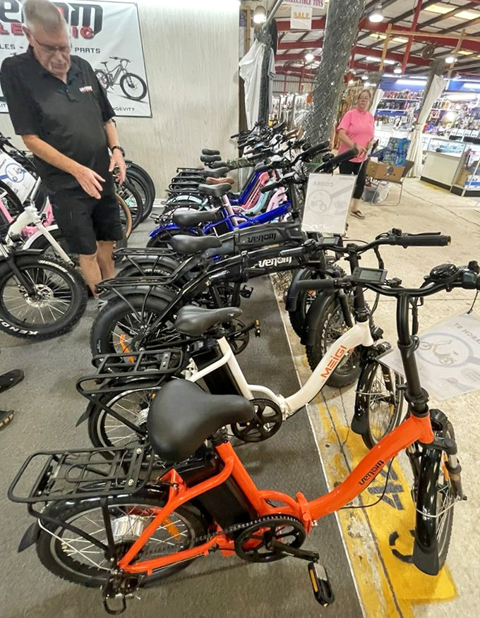Electric bikes and cycles line up like colorful steeds ready for their next adventure. Transportation solutions with a side of fun.