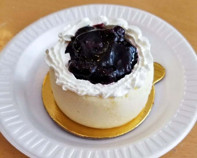 Blueberry cheesecake that manages to be both elegant and comforting, like finding your favorite dessert dressed for Sunday dinner.