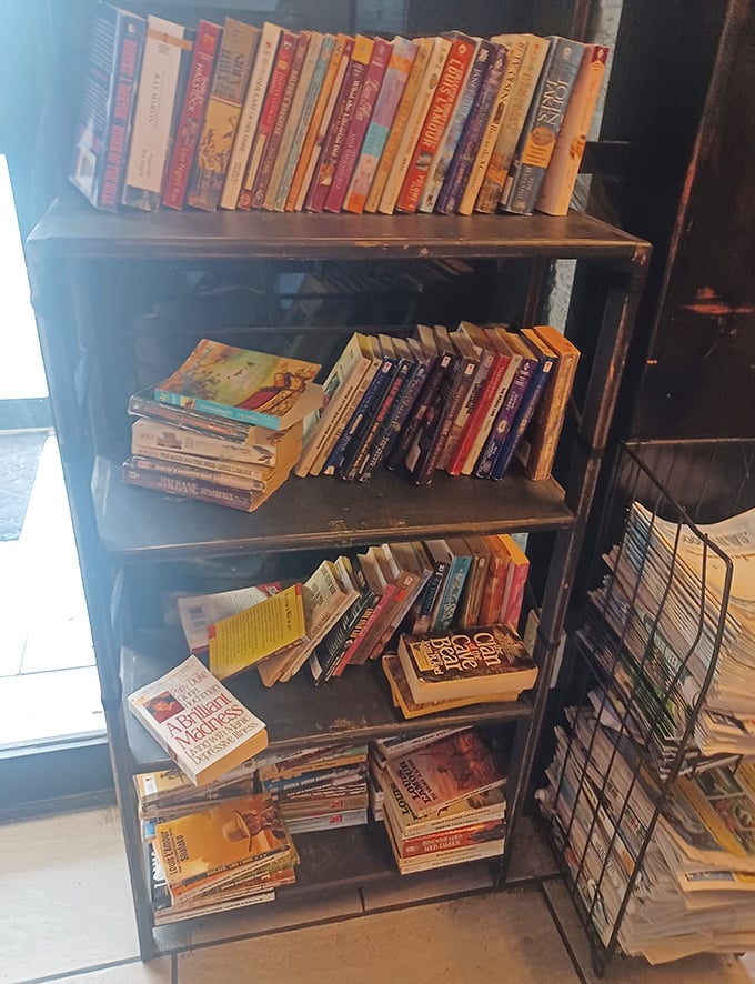 A bookshelf that invites you to linger after your meal. Trade paperbacks and trading recipes—both are community currencies here.