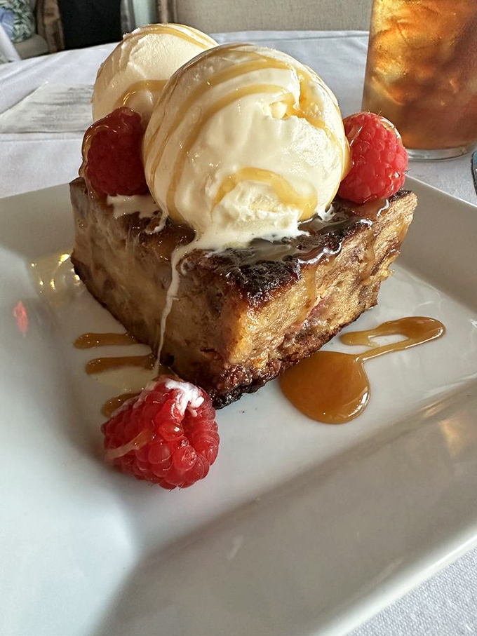 Bread pudding that makes you question every dessert decision you've ever made, topped with ice cream melting like your resistance.