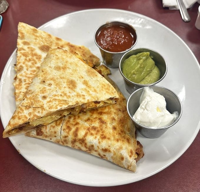 Breakfast quesadillas that brilliantly solve the tortilla-versus-toast debate. The trio of dipping sauces ensures no bite is ever boring.