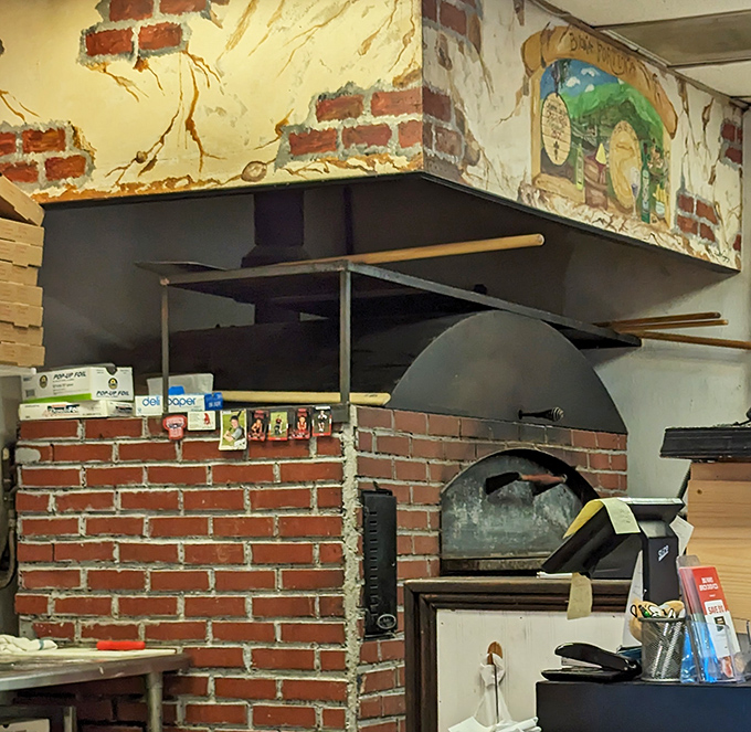 The brick oven isn't just equipment—it's the heart of the operation, turning dough into dreams at temperatures that would make the devil sweat.