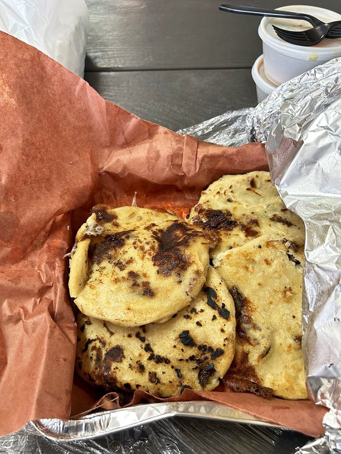 These aren't just pupusas—they're smoky, griddled pockets of joy that bridge Salvadoran tradition with Texas barbecue wisdom.