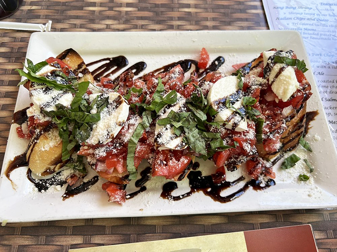 Bruschetta that's dressed better than most people at a wedding—fresh tomatoes, herbs, and balsamic creating a flavor explosion.