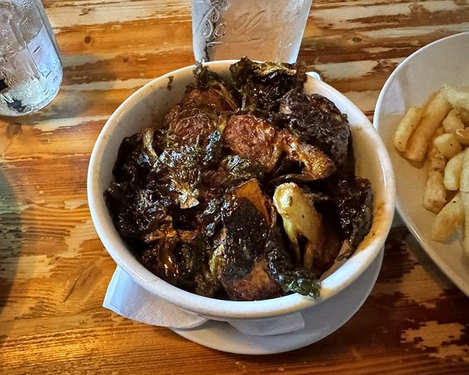 These aren't the Brussels sprouts of your childhood nightmares. Dark, caramelized, and mysterious—they've clearly lived an interesting life before reaching your table.