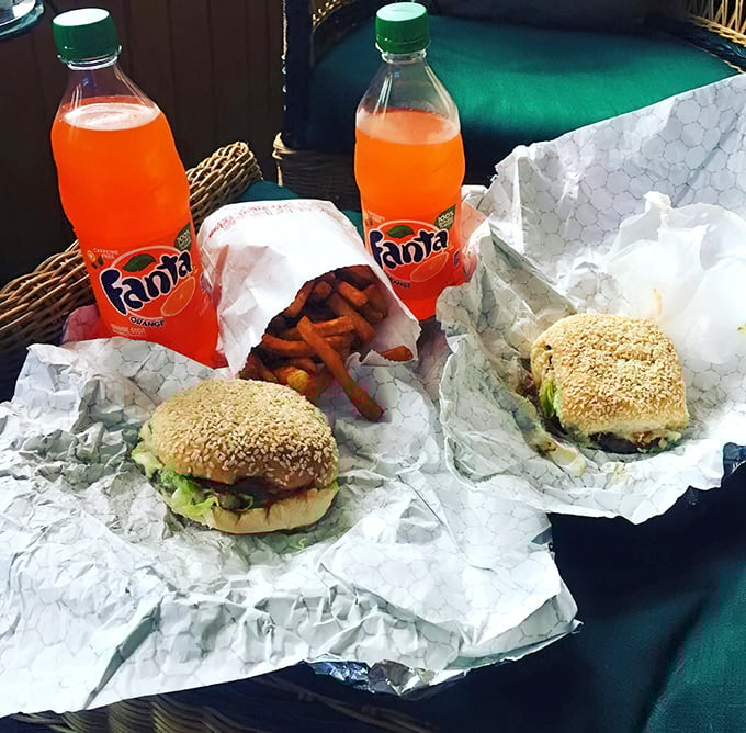 Sesame-seeded buns cradle perfectly grilled burgers. Fast food chains weep at what they can never achieve.