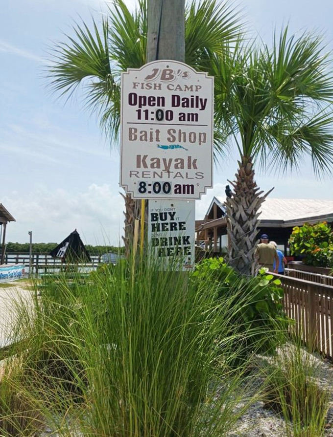 The sign says it all—restaurant, bait shop, and kayak rentals. JB's isn't just serving dinner; it's offering a complete Florida experience.