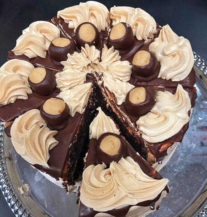 This isn't just dessert—it's performance art. A chocolate masterpiece topped with buttercream swirls and candy that demands appreciation.