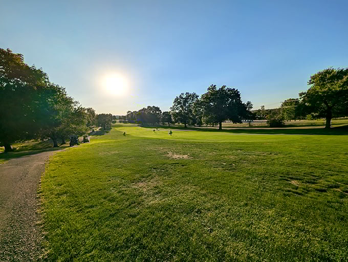 Cambridge Country Club greets the morning sun with dew-kissed fairways, where golf carts hum the soundtrack to retirement dreams come true.