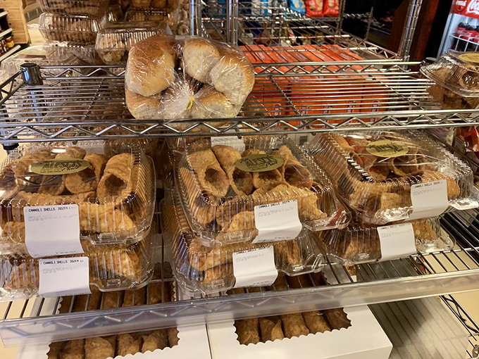 Cannoli shells waiting for their sweet filling destiny—crispy vehicles of joy lined up like delicious soldiers ready for dessert duty.