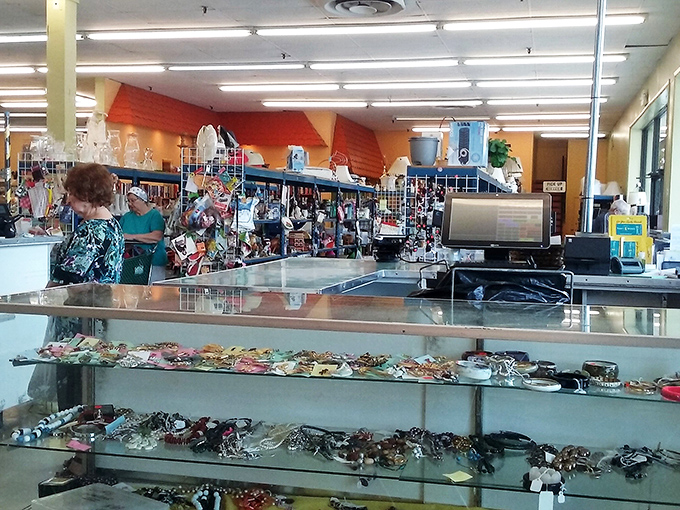 The checkout counter's jewelry display showcases decades of accessorizing trends – from statement pieces that scream 1980s to delicate chains waiting for their comeback.