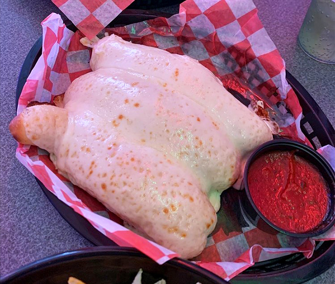 Cheese breadsticks that achieve that mythical balance—crispy edges, soft centers, and enough cheese to make Wisconsin proud.