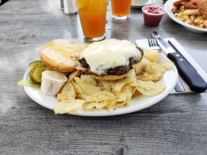 This isn't just a cheeseburger—it's a statement of purpose. The melted cheese blanket tucks in a patty that's clearly lived its best life.