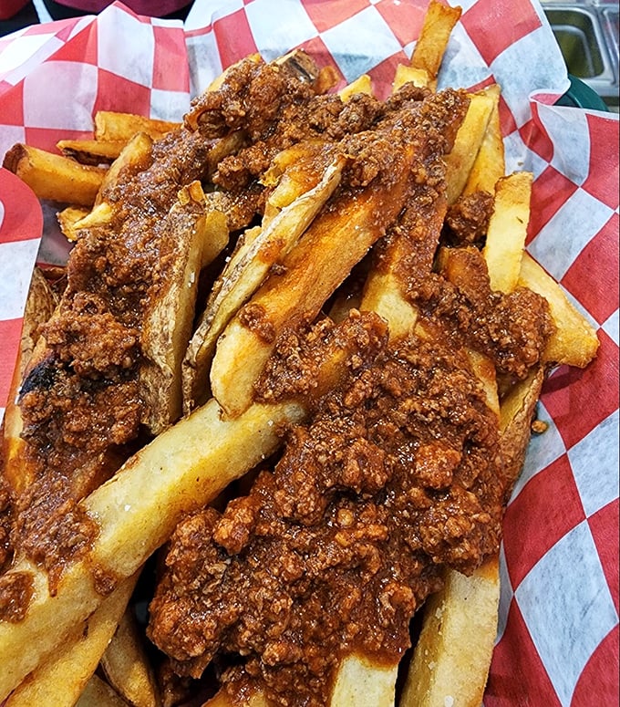 Chili fries that laugh in the face of dainty eating. This glorious mess demands both fork and commitment – totally worth the napkin investment.