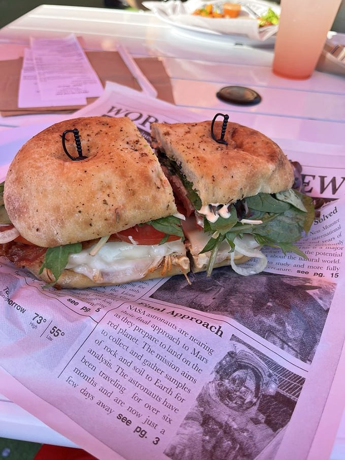 This sandwich isn't just stacked—it's architecturally sound. Fresh greens and perfectly toasted ciabatta make newspaper reading optional but recommended.